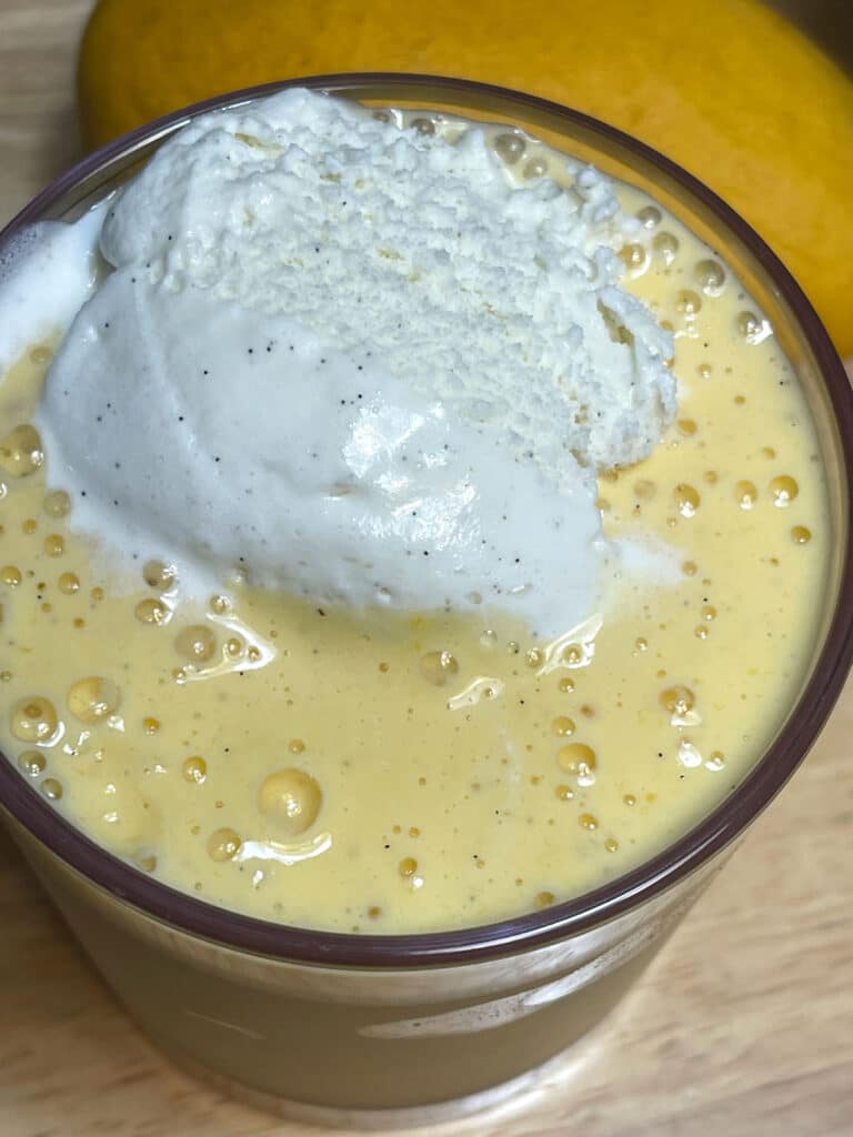Mango Vanilla Milkshake With Ice Cream And Ripe Mangoes